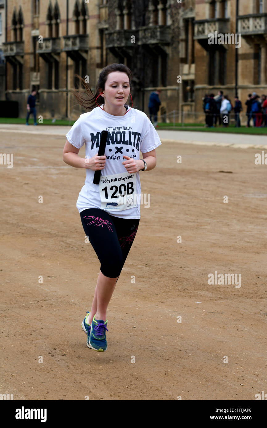 A female student running past Christ Church College in the Teddy Hall ...