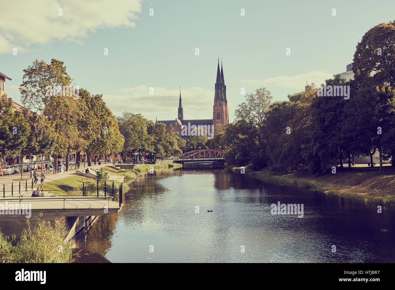 View along the river Fyris towards Uppsala Cathedral and Haglund bridge ...