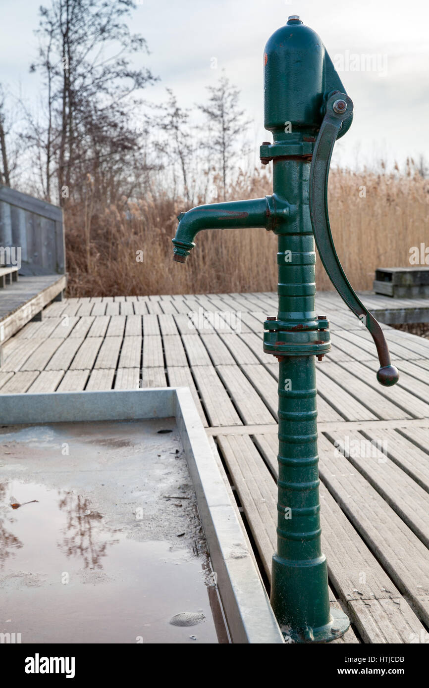 Vintage manual water pump, close up photo Stock Photo - Alamy