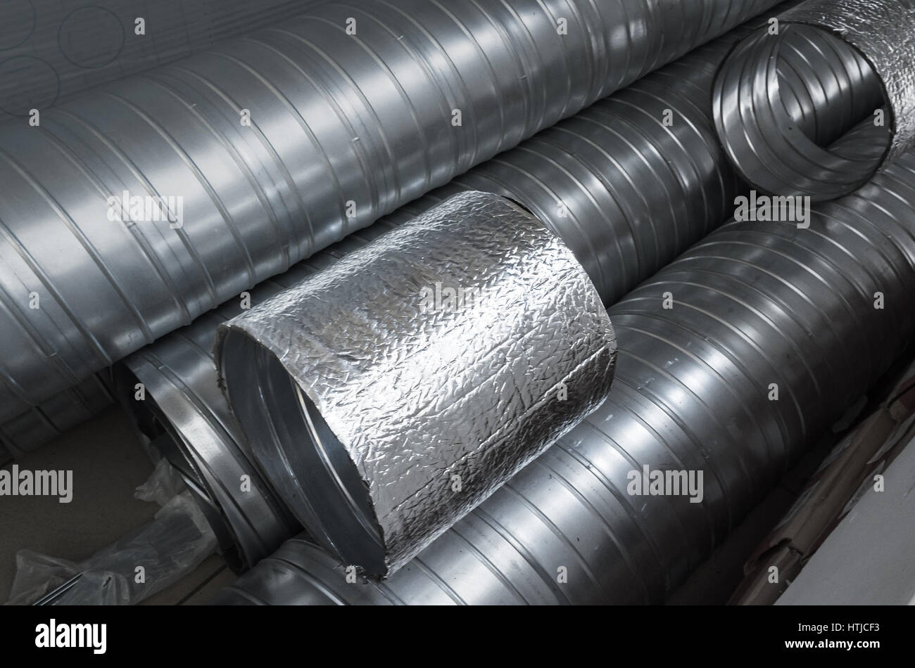 Group of shiny metallic tubes for air ventilation systems Stock Photo ...