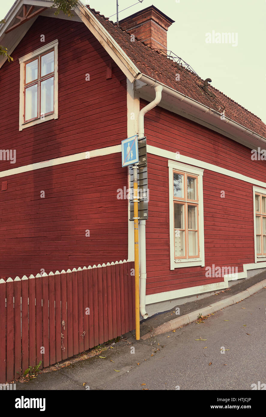 Pedestrian warning sign and traditional wooden house, Sweden ...