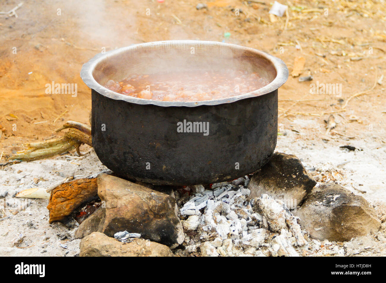 A cooking soup in pot on bonfire Stock Photo - Alamy