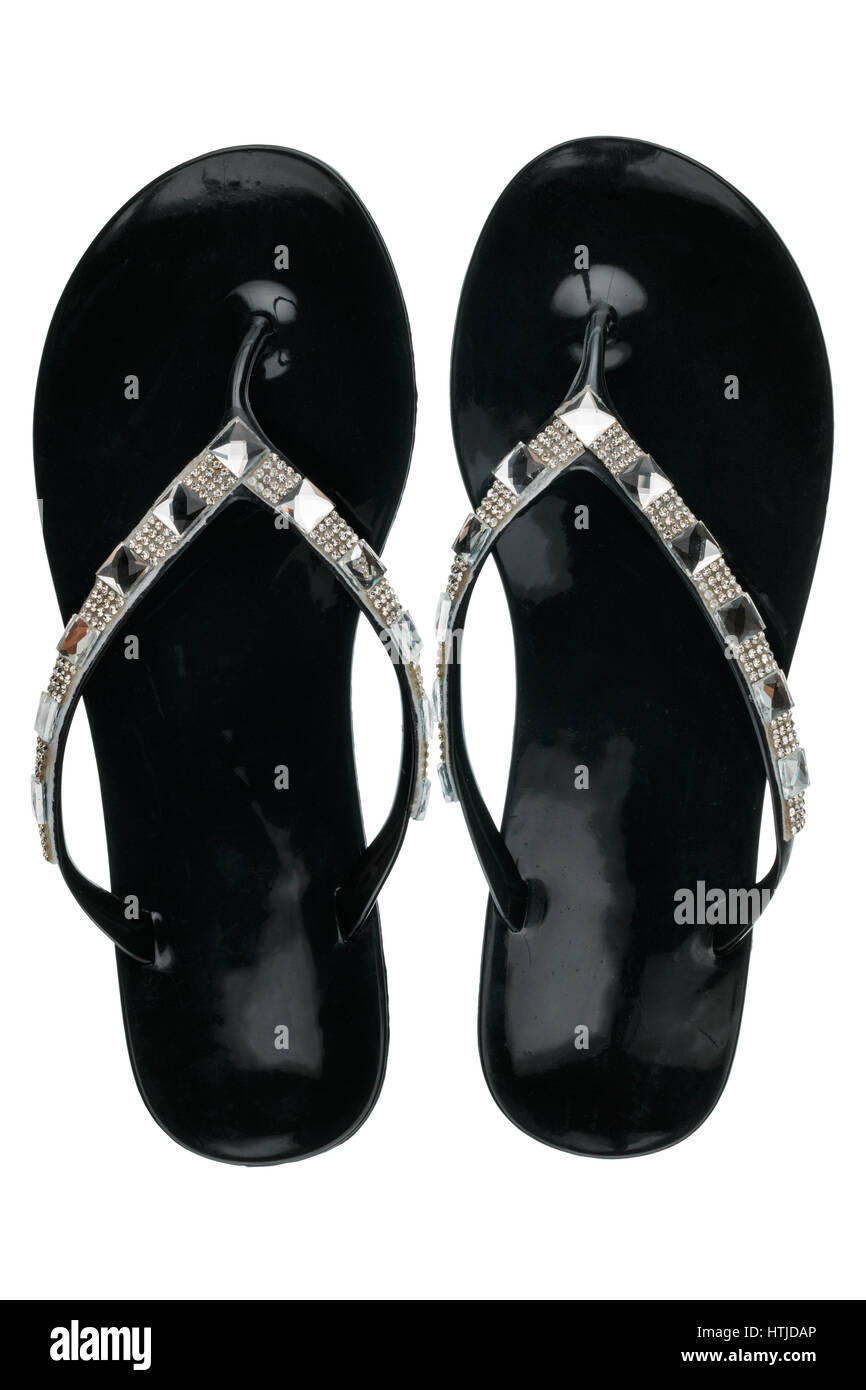 Pair of black beach sandals in rhinestones, isolated on white ...