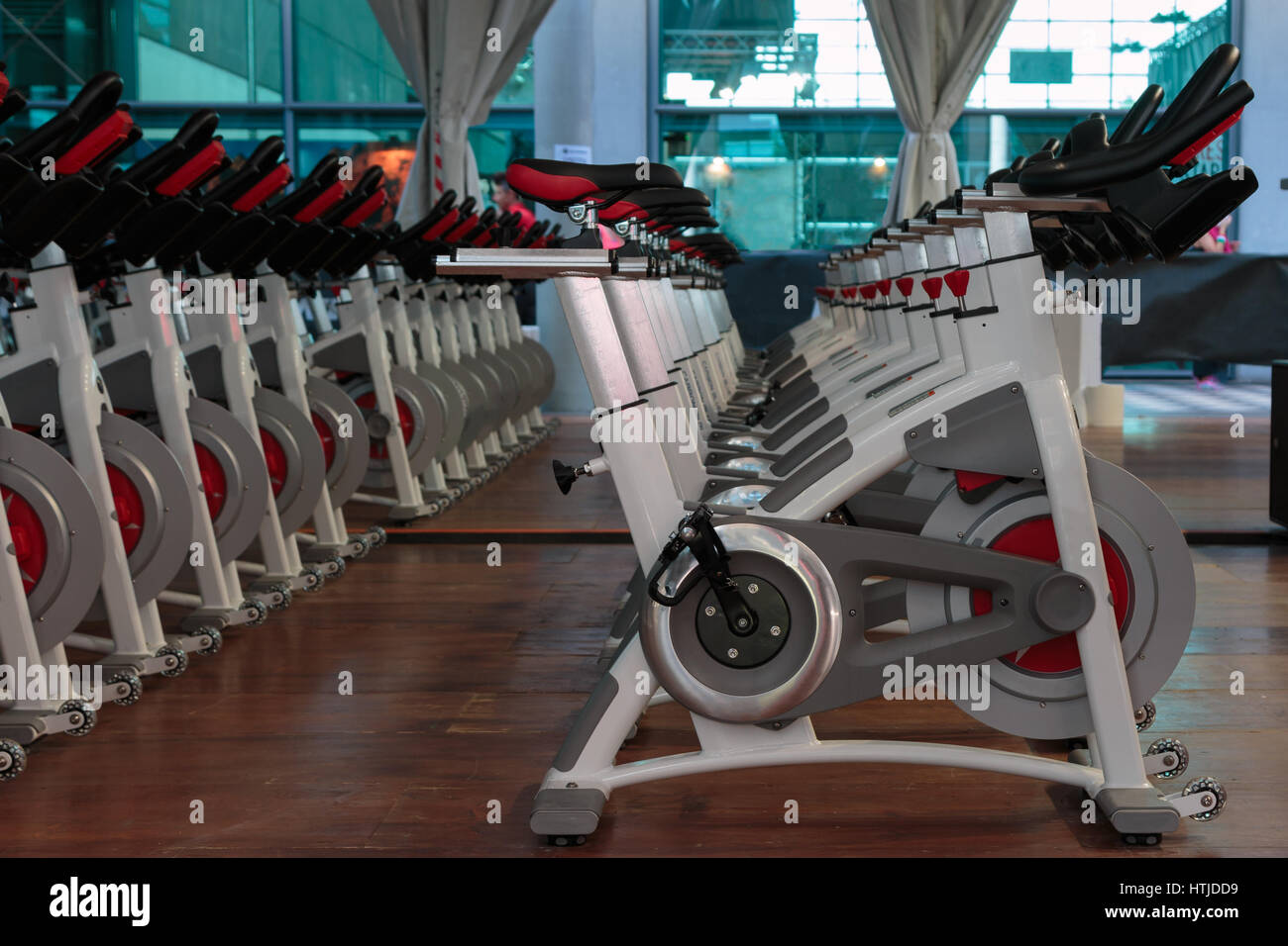 Fitness Workout in Gym: Group of Modern Spinning Bikes in Line Stock ...