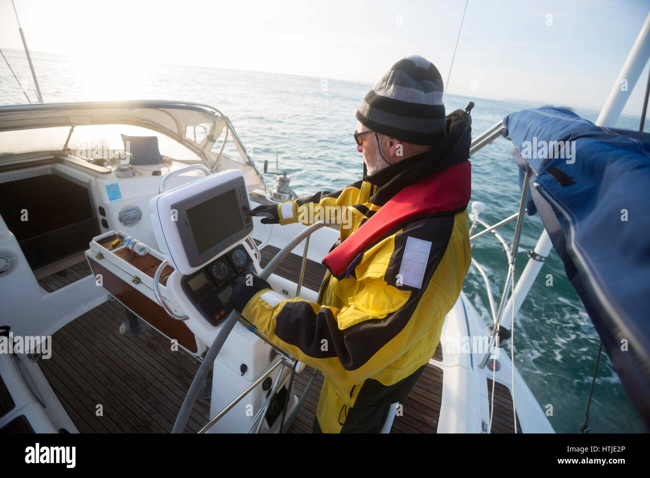 Men operating boat hi-res stock photography and images - Alamy