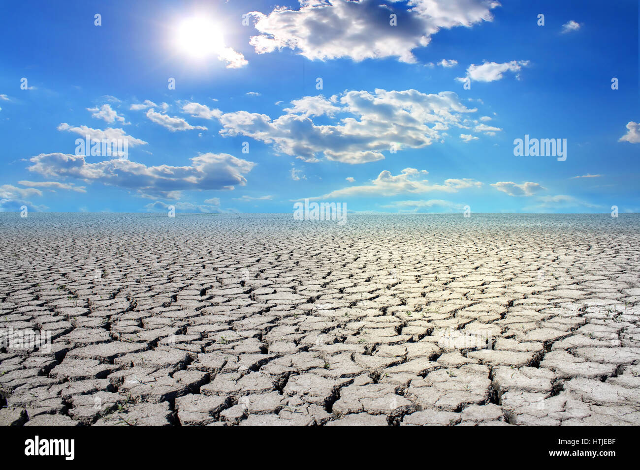 Drought cracks, a cold sunset Stock Photo - Alamy