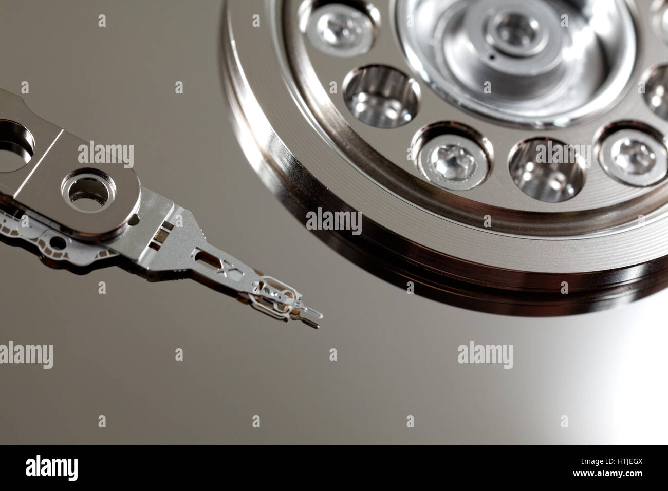 Close-up of read-and-write head and disk platter in hard disk drive ...