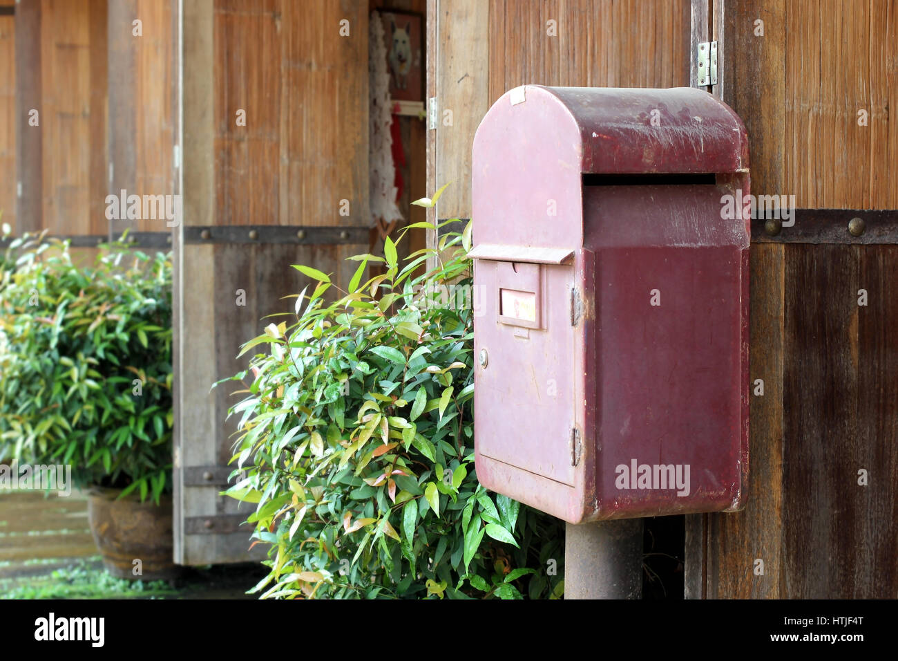old red post box in front of a house Stock Photo - Alamy