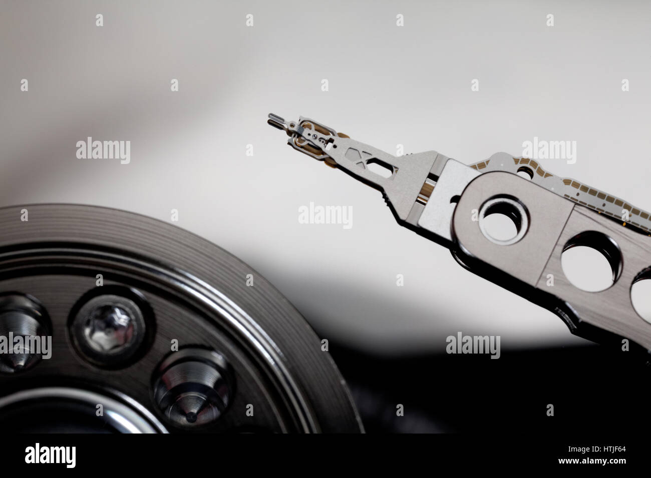 Close-up of read-and-write head and disk platter in hard disk drive ...