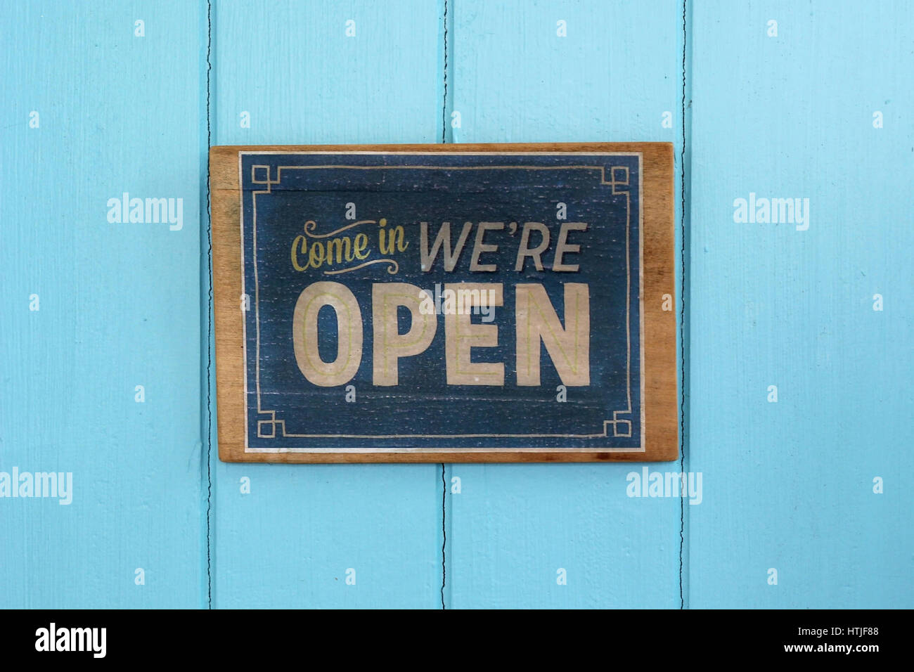 vintage open sign on blue wooden door Stock Photo - Alamy