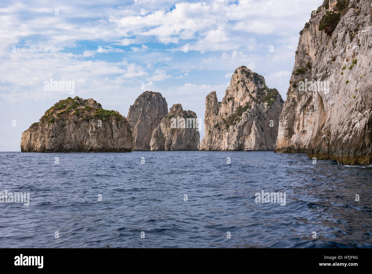 View of cliff coast of Capri Island with famous Faragioni rocks, Italy ...