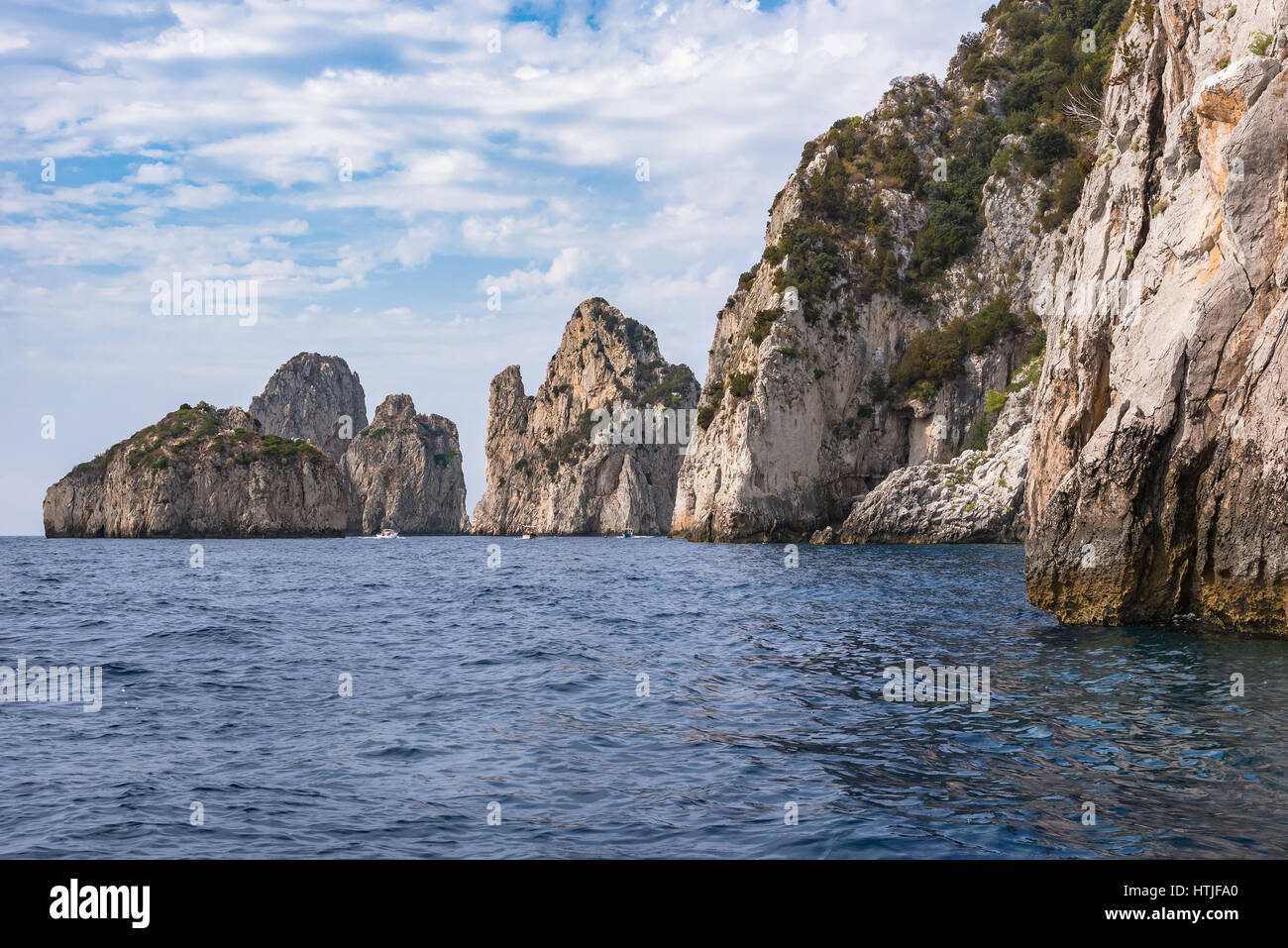 View of cliff coast of Capri Island with famous Faragioni rocks, Italy ...