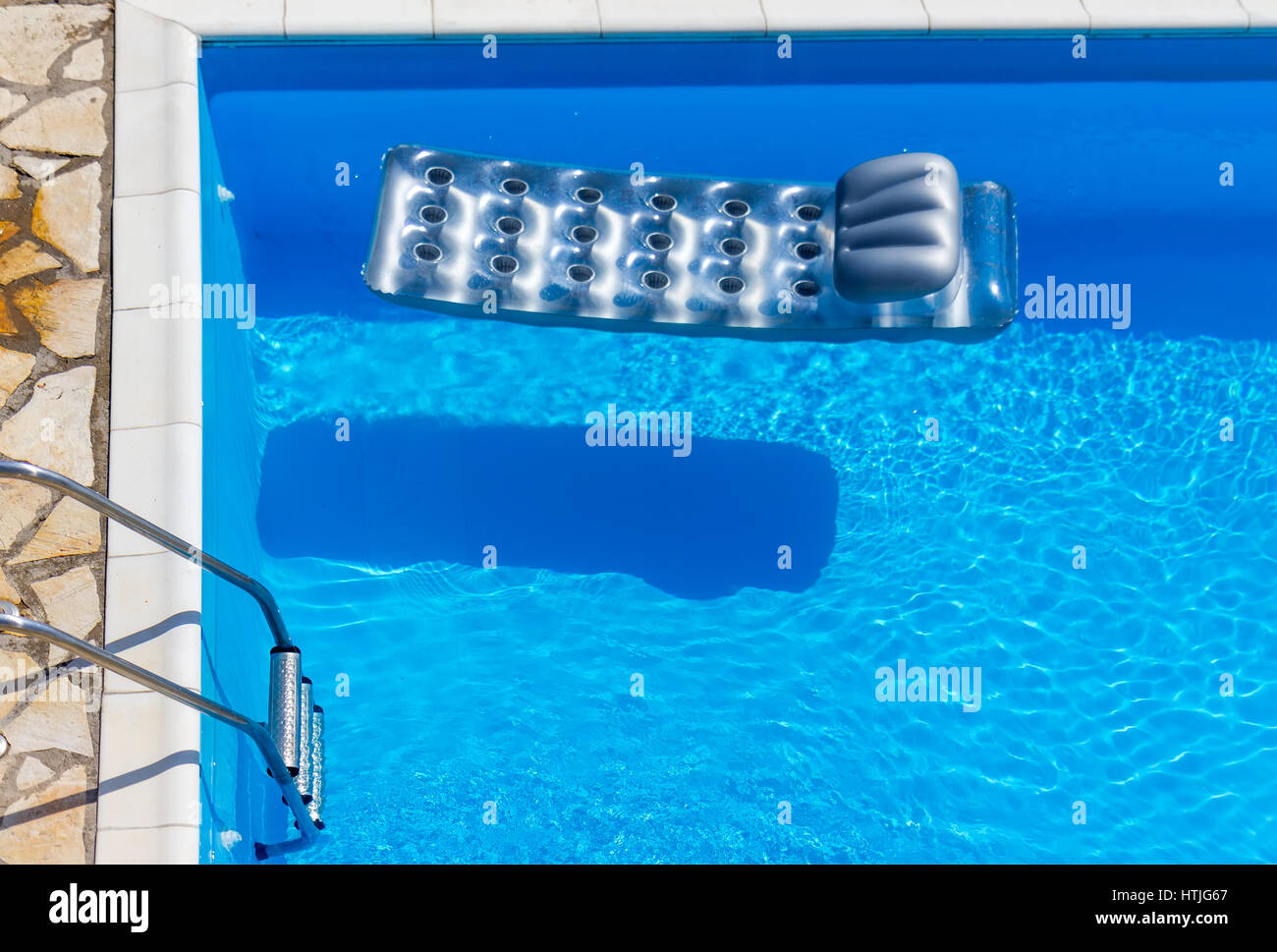 Mattress in the swimming pool Stock Photo - Alamy