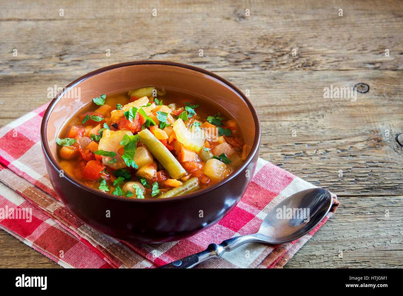 Vegetable soup over rustic wooden background with copy space - healthy ...