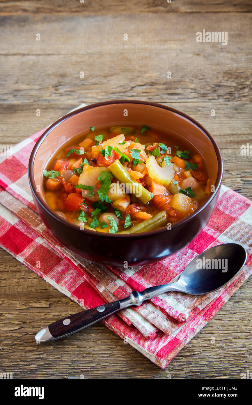 Vegetable soup over rustic wooden background with copy space - healthy ...