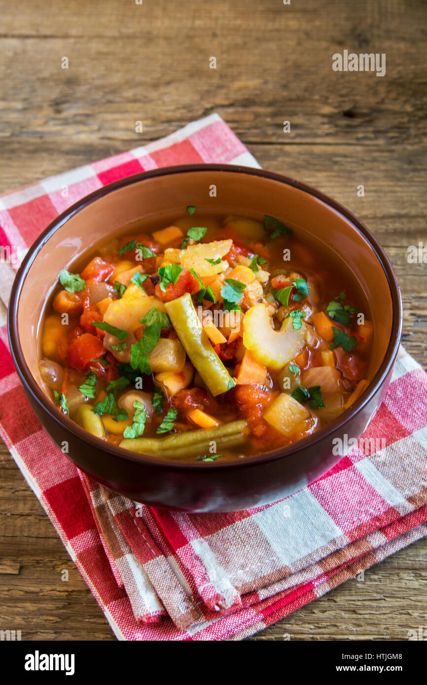 Vegetable soup over rustic wooden background with copy space - healthy ...