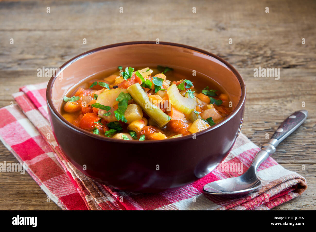 Vegetable soup over rustic wooden background with copy space - healthy ...
