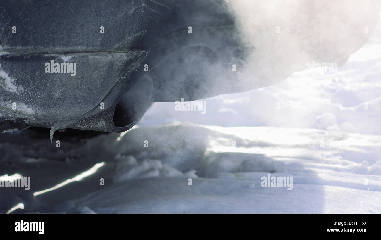 Car pipe puffs out exhaust gas clouds. Smoke clouds coming out of ...