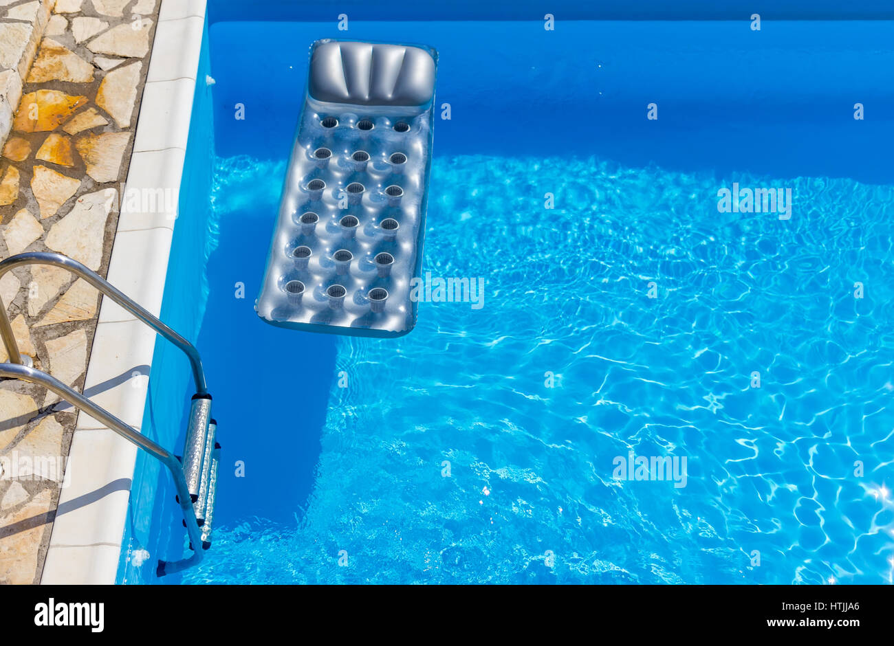 Mattress in the swimming pool Stock Photo - Alamy