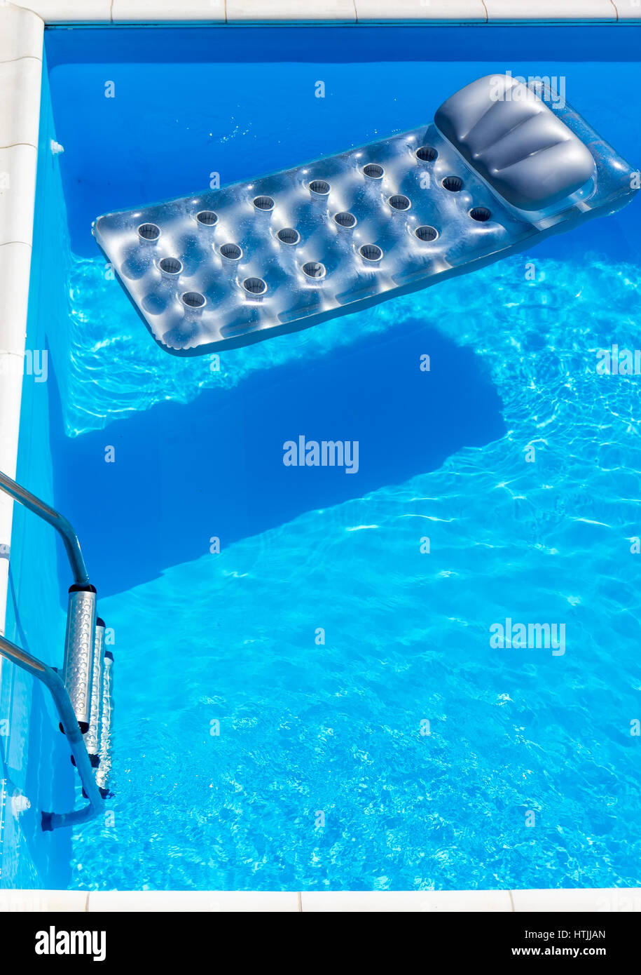 Mattress in the swimming pool Stock Photo - Alamy