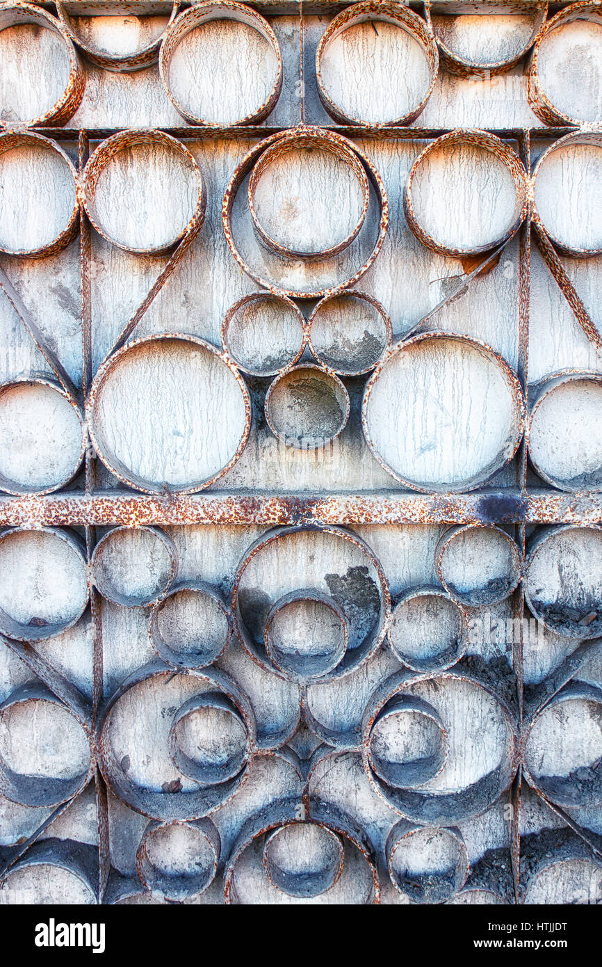 An old rusty metal fence. Facade of an old building Stock Photo - Alamy