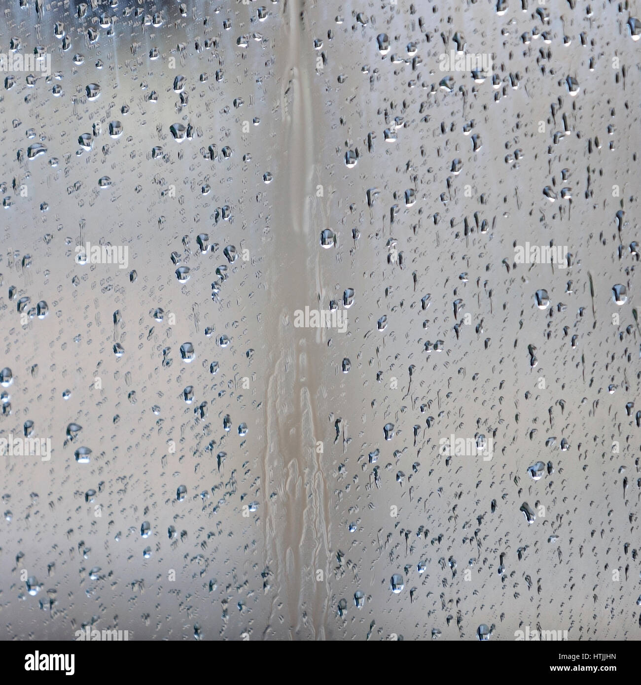 glass pane with raindrops and water during rain storm Stock Photo - Alamy
