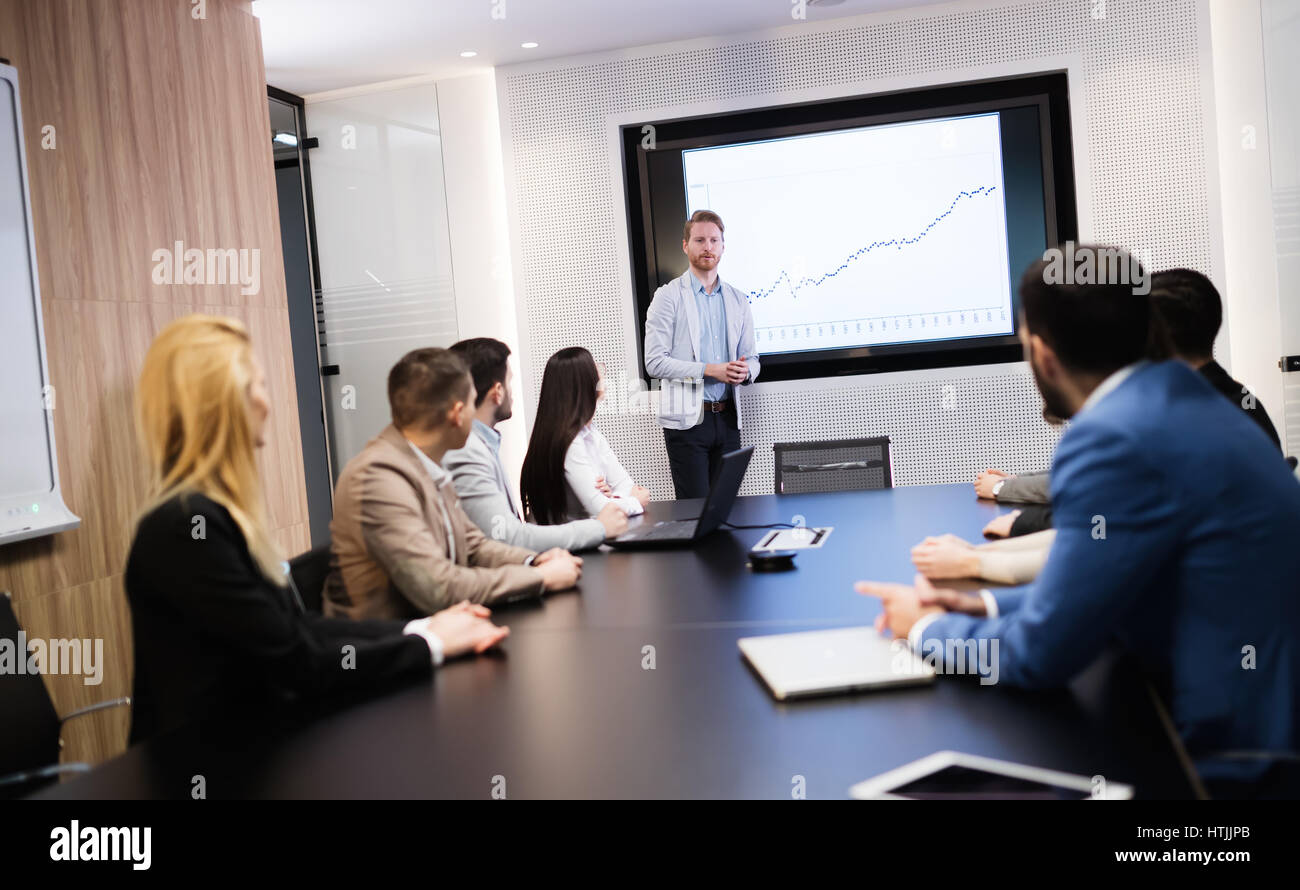 Business meeting and presentation in modern conference room for ...