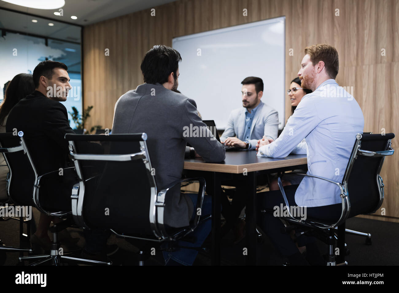 Business meeting and presentation in modern conference room for ...