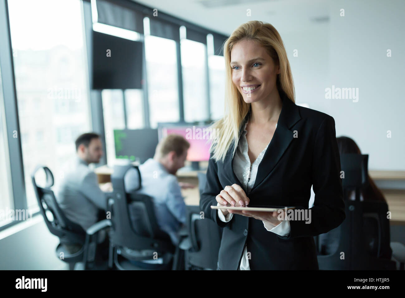 Businesswoman using tablet at information technology workplace Stock ...