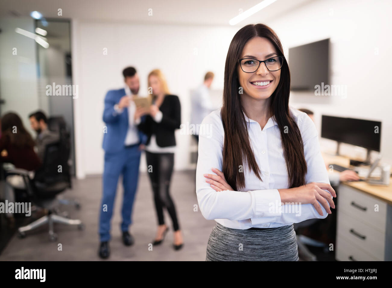 Portrait of female smiling company ceo in office Stock Photo - Alamy