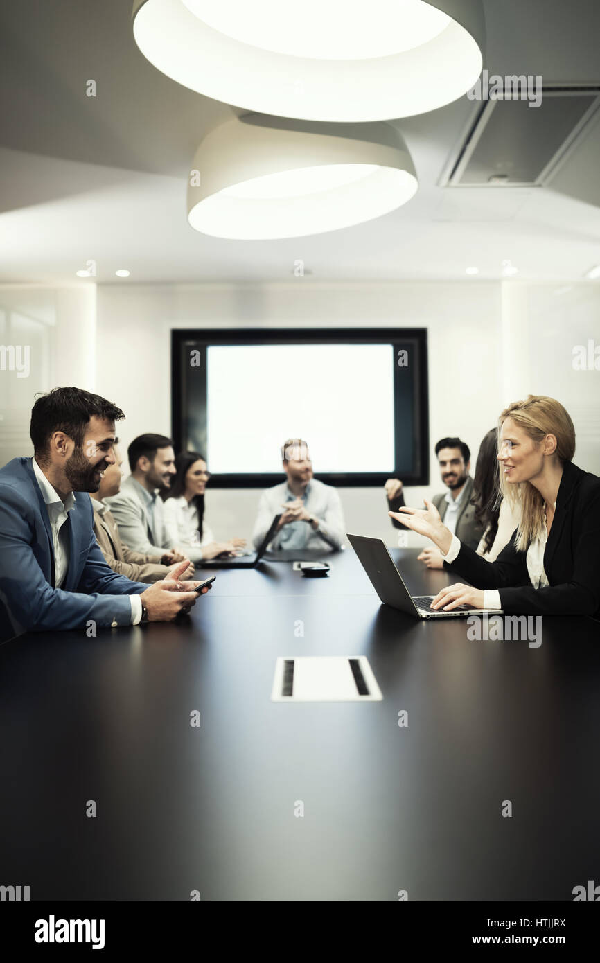Business meeting and presentation in modern conference room for ...