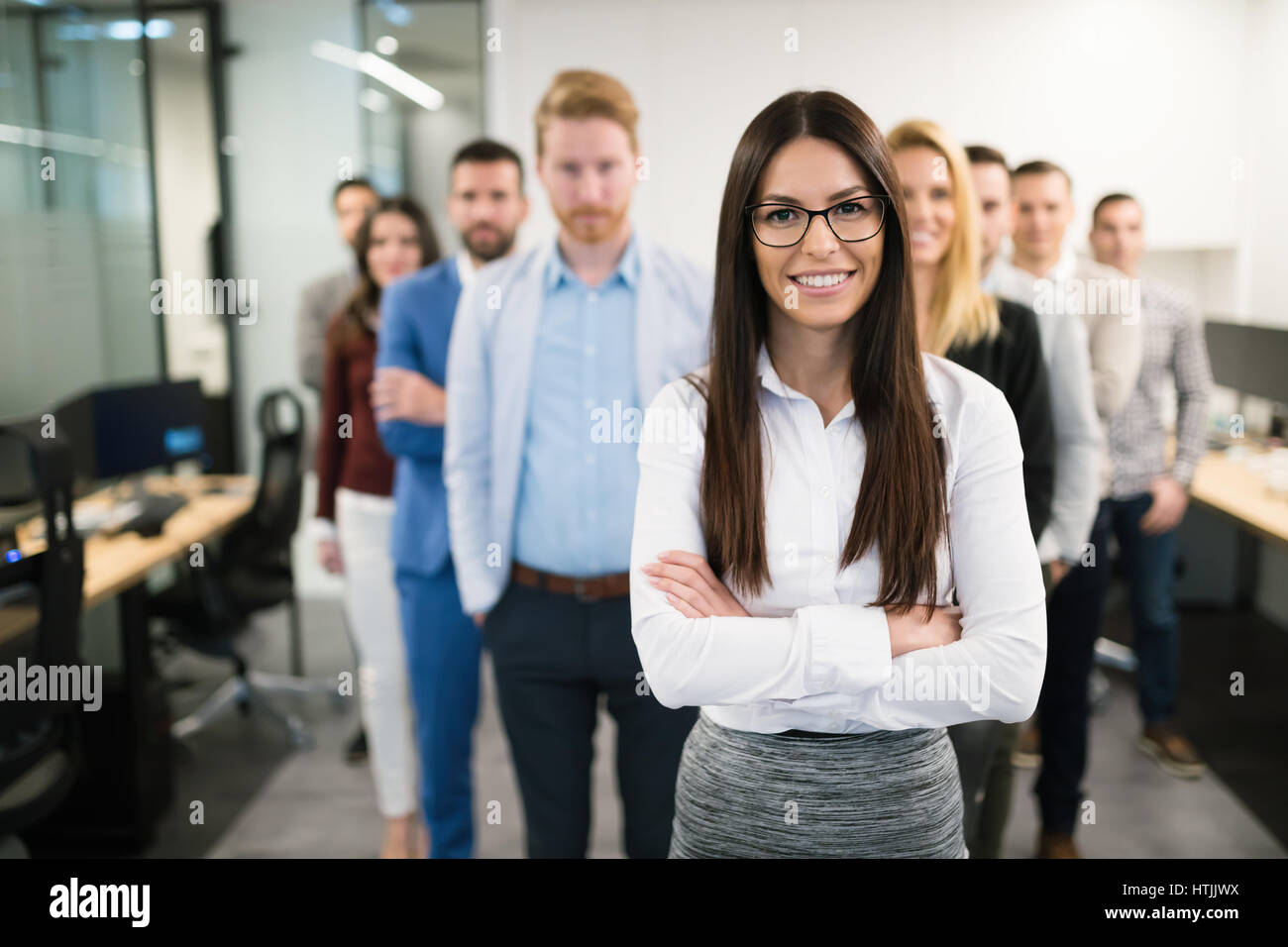 Portrait of business woman in officess representing company Stock Photo ...