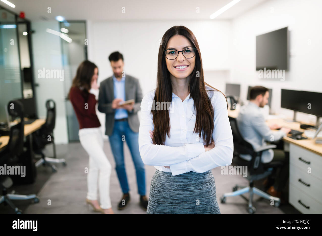 Portrait of female smiling company ceo in office Stock Photo - Alamy