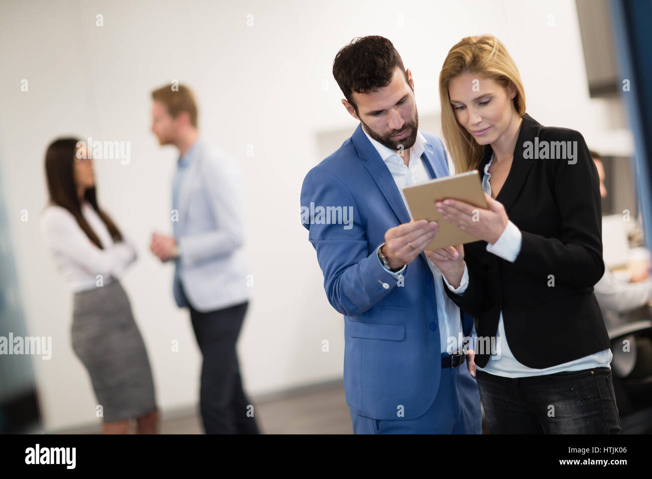 Professional business people at meeting collaborating in office Stock ...