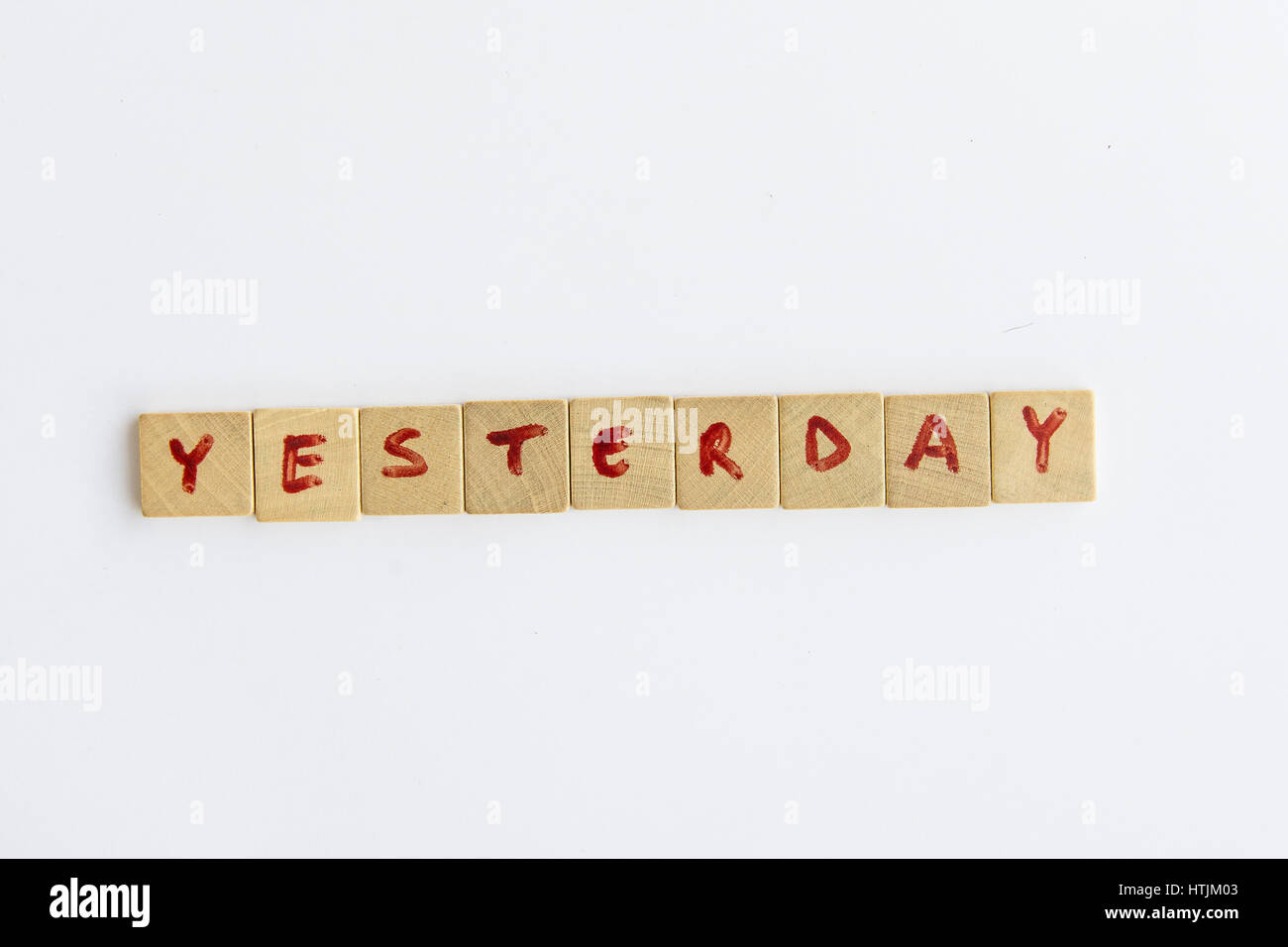 the word Yesterday formed with letters written on squares of wood ...