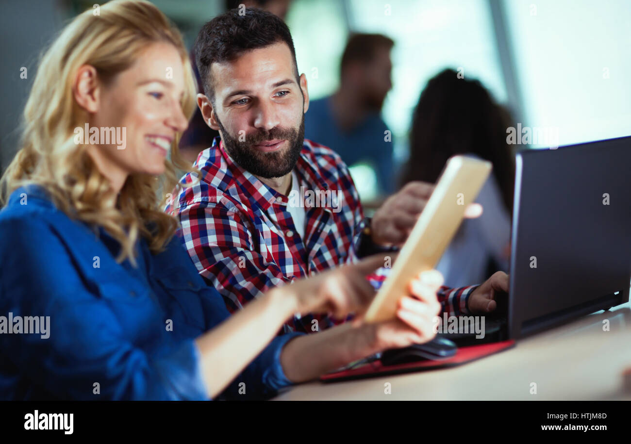 Programmers cooperating at IT company developing apps Stock Photo - Alamy