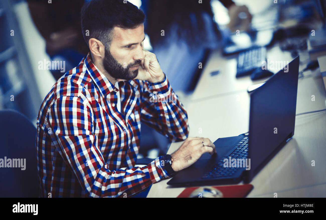 Programmer working at software developement company office Stock Photo ...