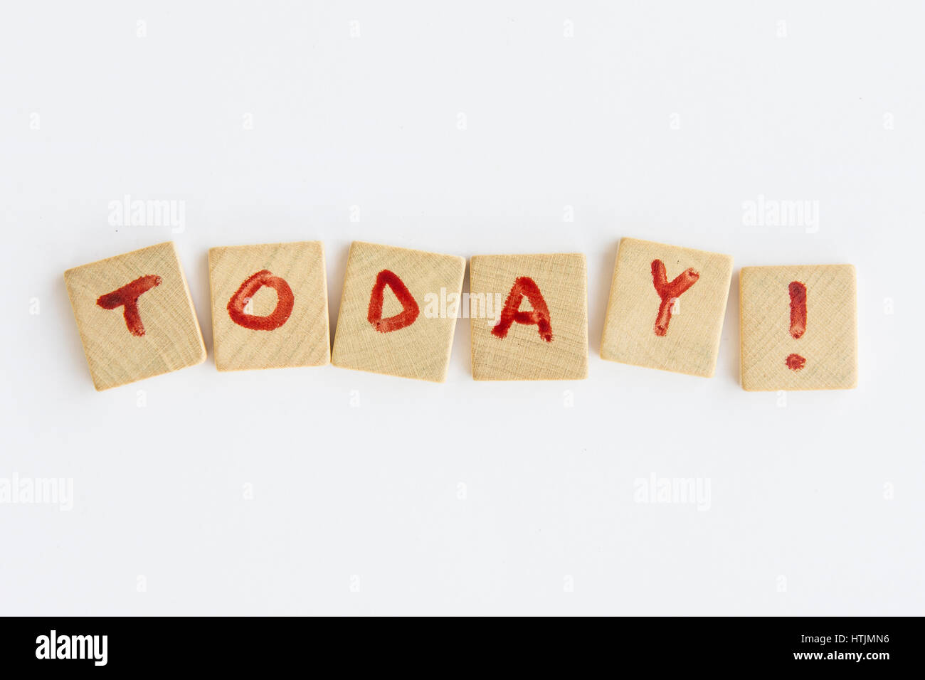 the word Today formed with letters written on squares of wood dowels ...