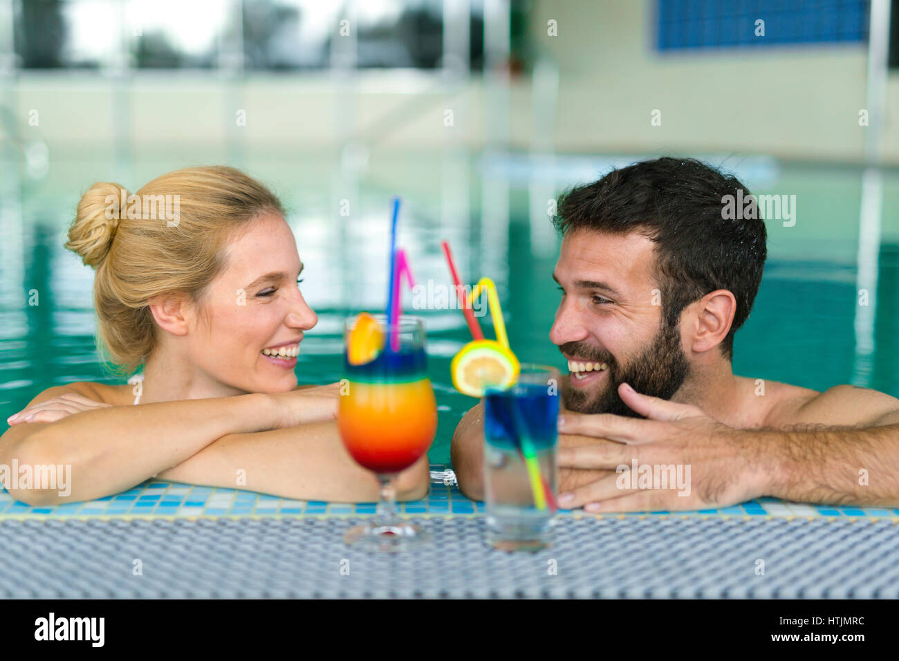 Happy coupleenjoying treatments and relaxing at wellness spa center ...