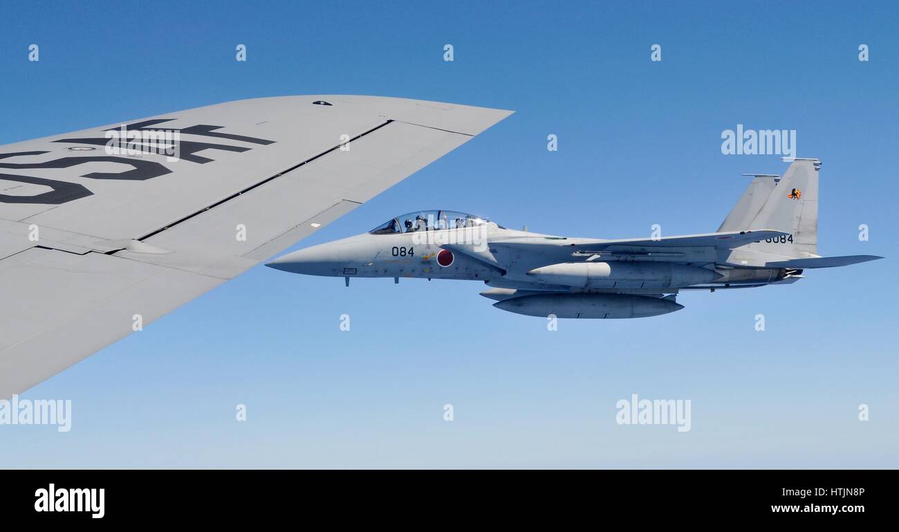 A Japanese Self-Defense Force Boeing F-15 Strike Eagle fighter aircraft waits to refuel in ...