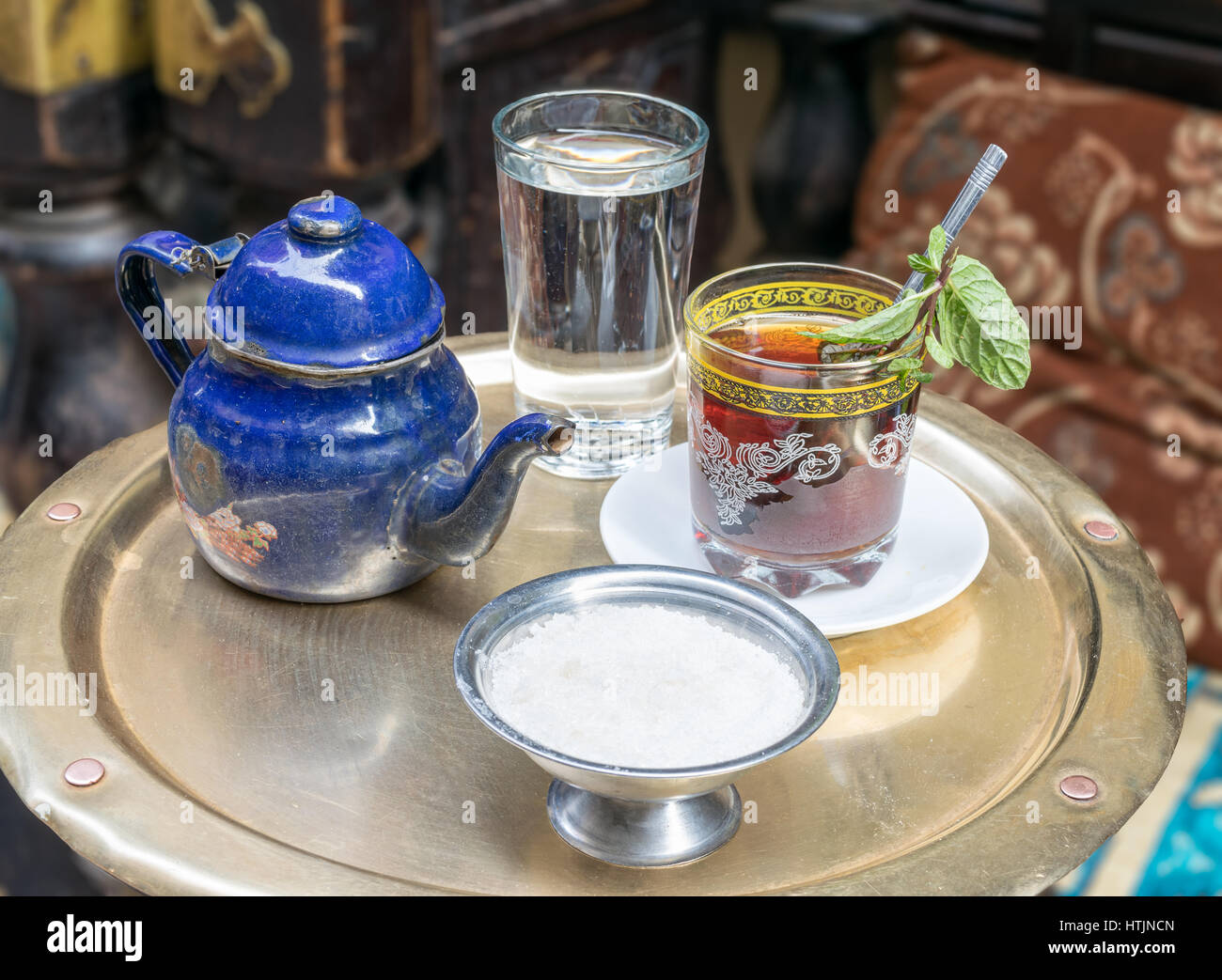 Traditional mint tea set on copper table in an oriental cafe at Khan El ...