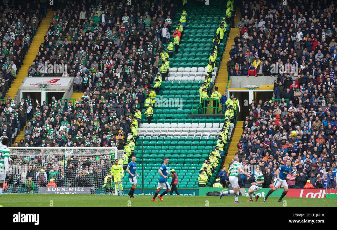 Police separate Celtic and Rangers fans in the stands during the ...