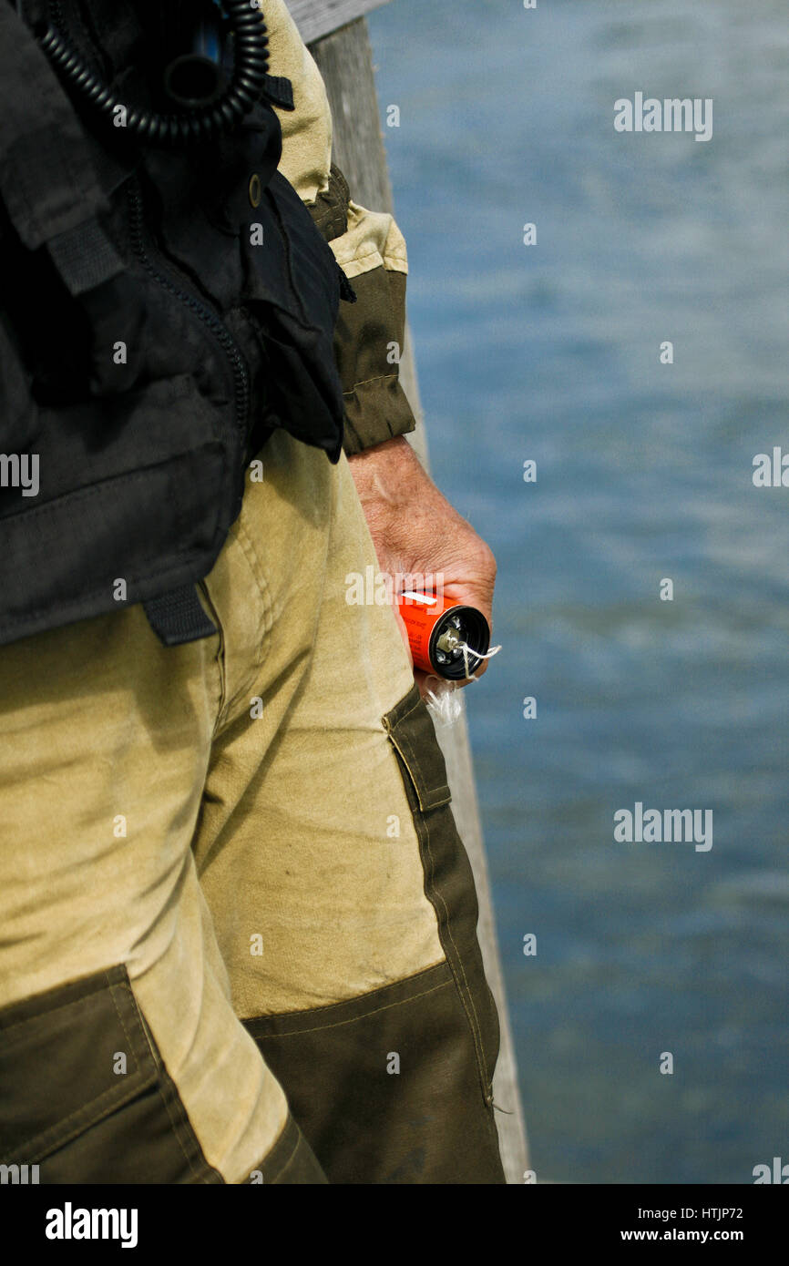 Ranger with flare. Kurile National Park, Kamchatka. Russia Stock Photo ...