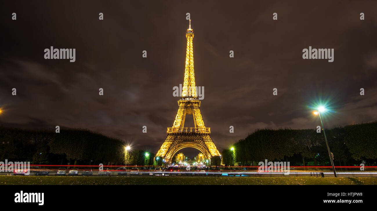 The Iconic Eiffel tower of Paris glowing in the night Stock Photo - Alamy
