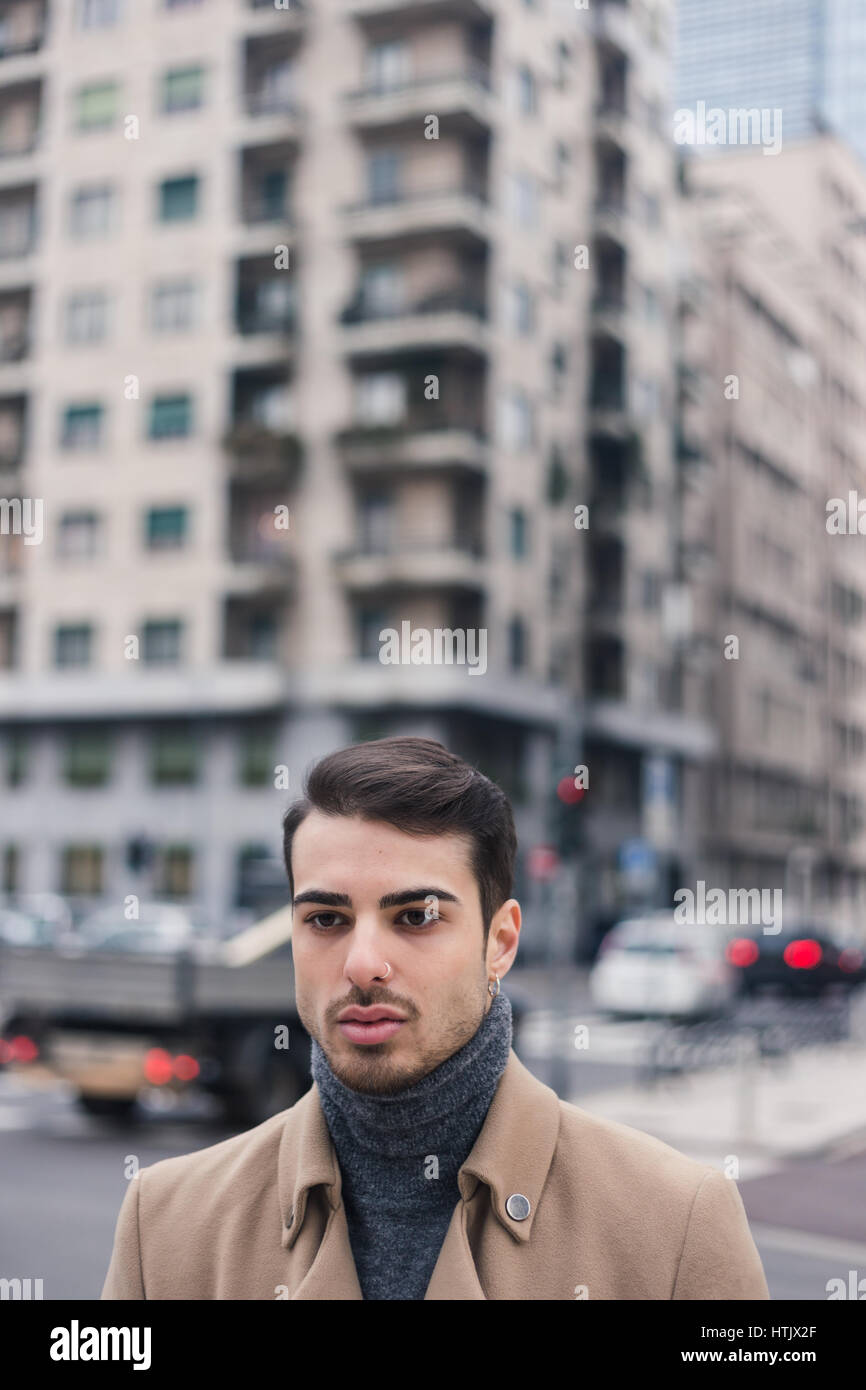 Beautiful young man with short hair posing in an urban context Stock Photo - Alamy