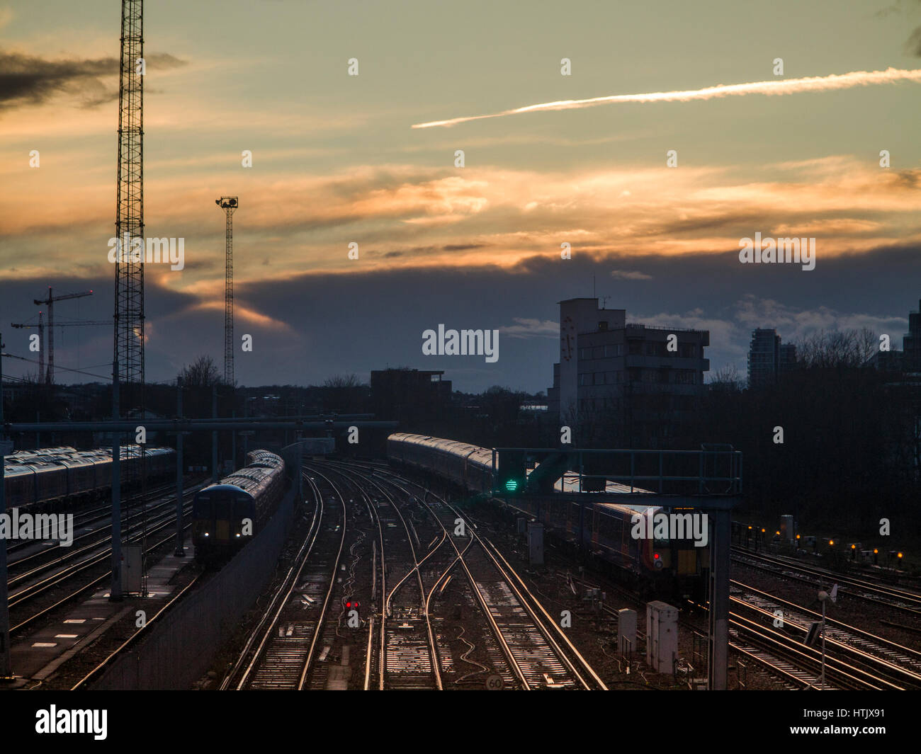 London: Dramatic skies over Clapham Junction station as trains arrive ...