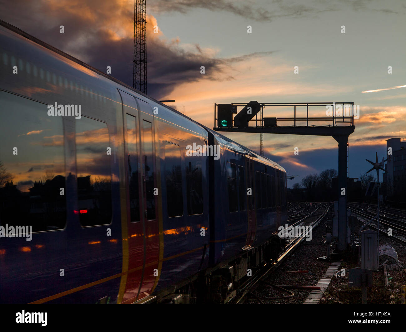 London: Dramatic skies over Clapham Junction station as trains arrive ...