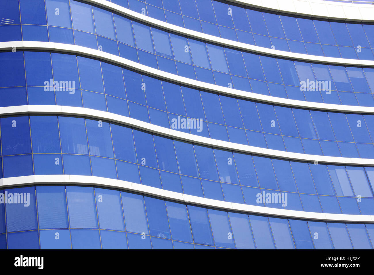 Glass wall of business center Stock Photo - Alamy