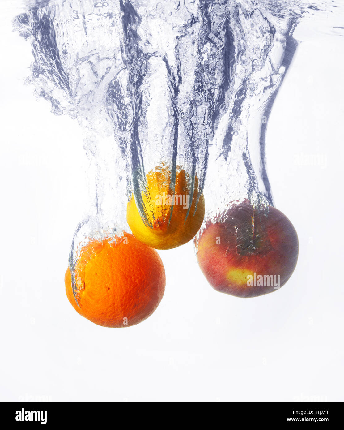 Fresh fruits in water splash Stock Photo - Alamy