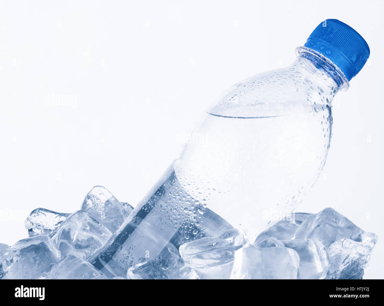 Water bottle in ice on white background Stock Photo - Alamy